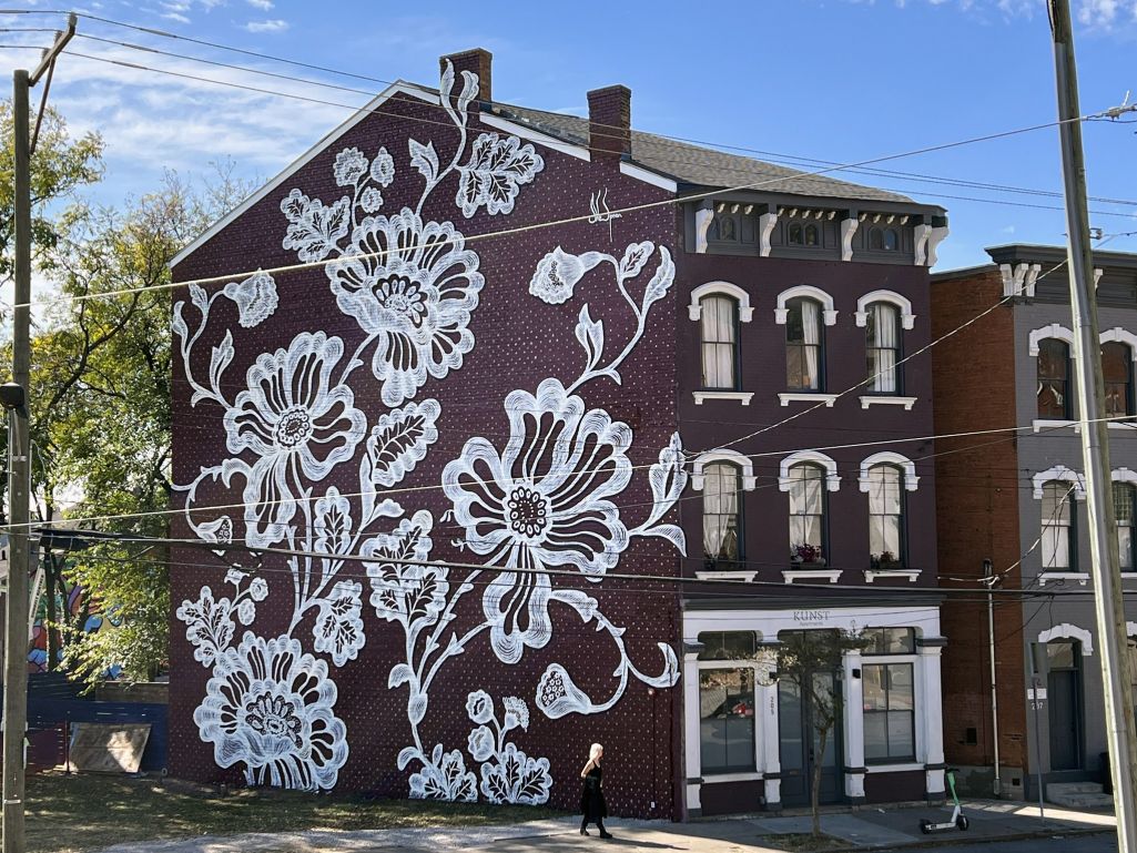 Who is the Polish street artist behind the giant lace murals found in ...